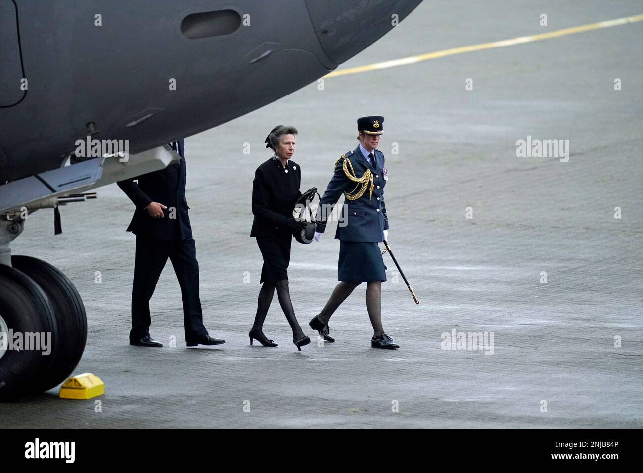 Princess Anne and Vice Admiral Sir Tim Lawrence watch as the coffin of ...