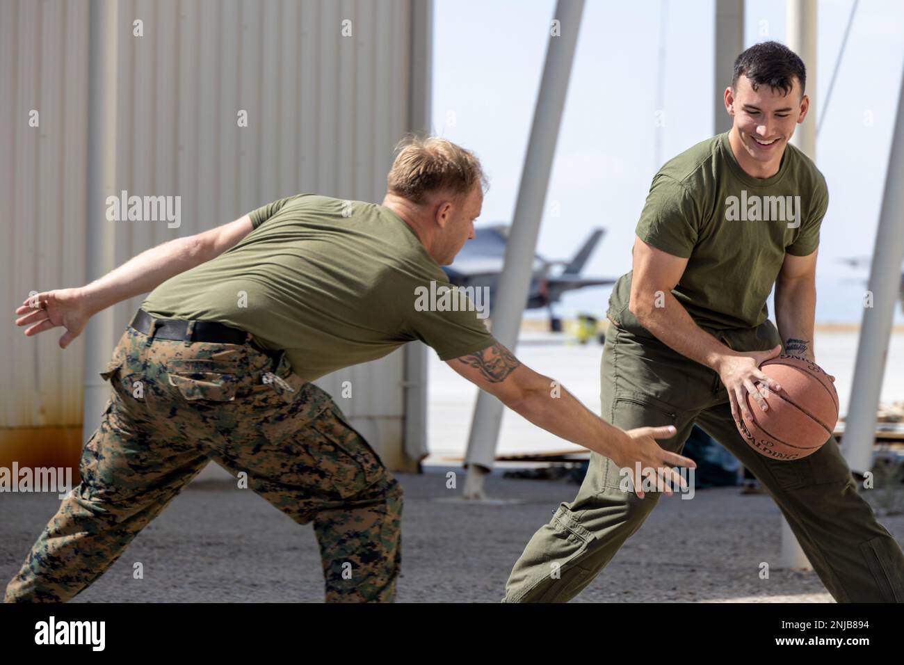 U.S. Marine Corps Staff Sgt. Brian Stacks (left) and Cpl. Eric Lyons ...