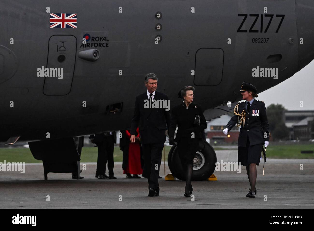 Britain's Princess Anne, center, and Vice Admiral Timothy Laurence ...