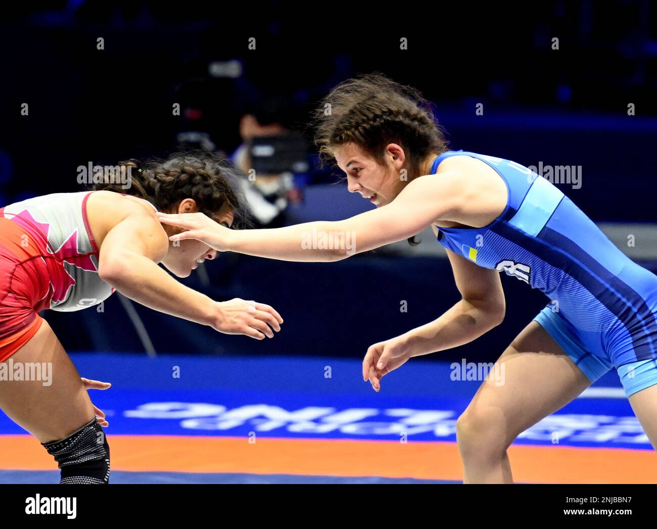 Oleksandra KHOMENETS of Ukraine (blue) and Karla Lorena GODINEZ ...