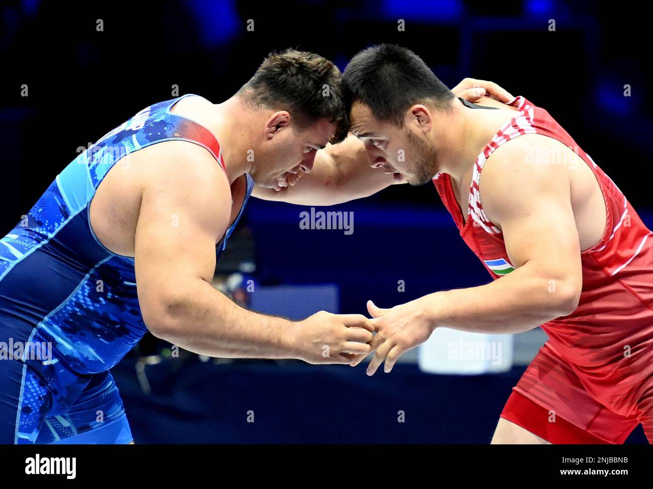 Riza KAYAALP of Turkey and Muminjon ABDULLAEV of Uzbekistan compete during the semifinal of ...