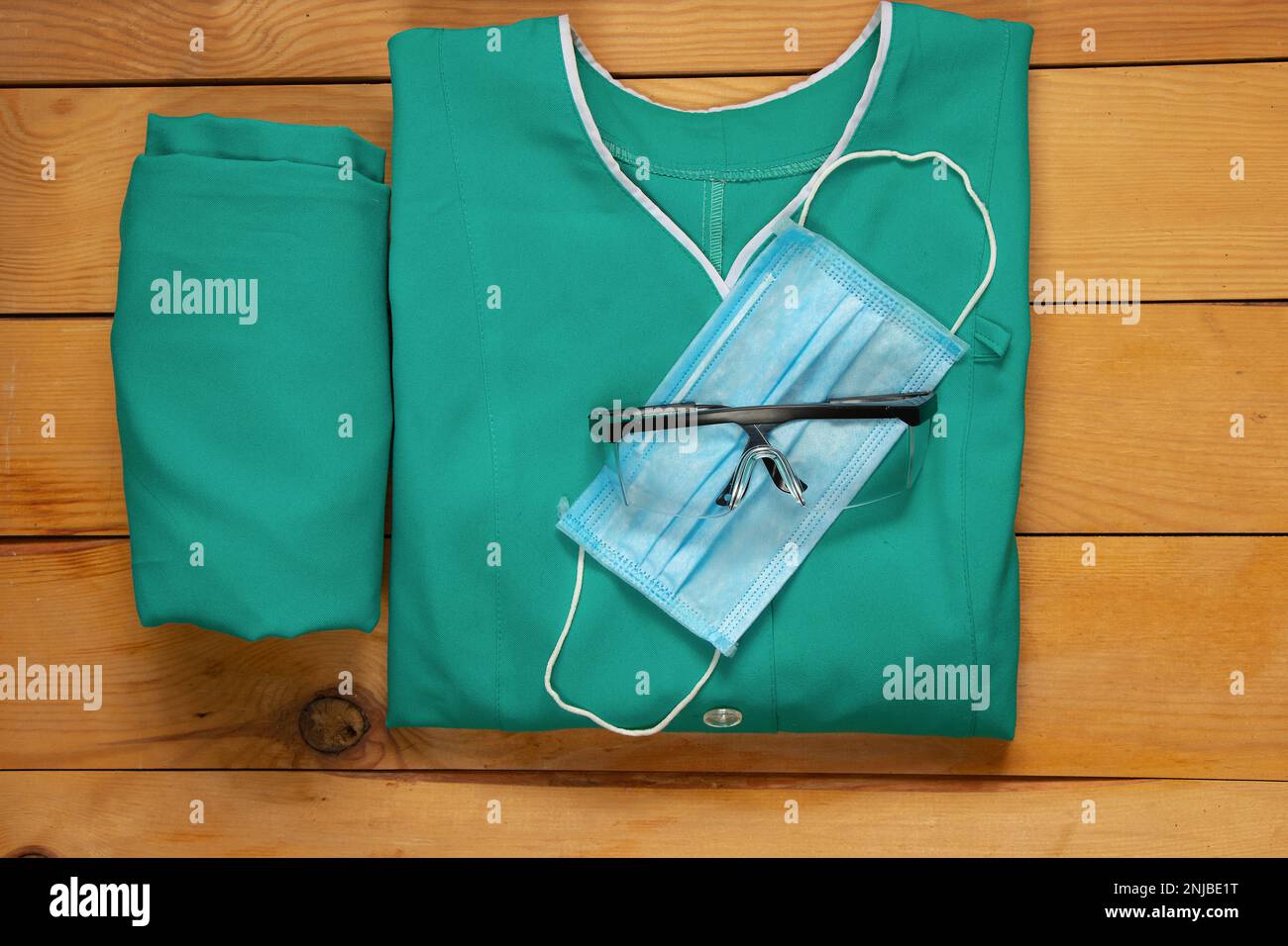 medical uniform set folded on an isolated background nurse Stock Photo ...