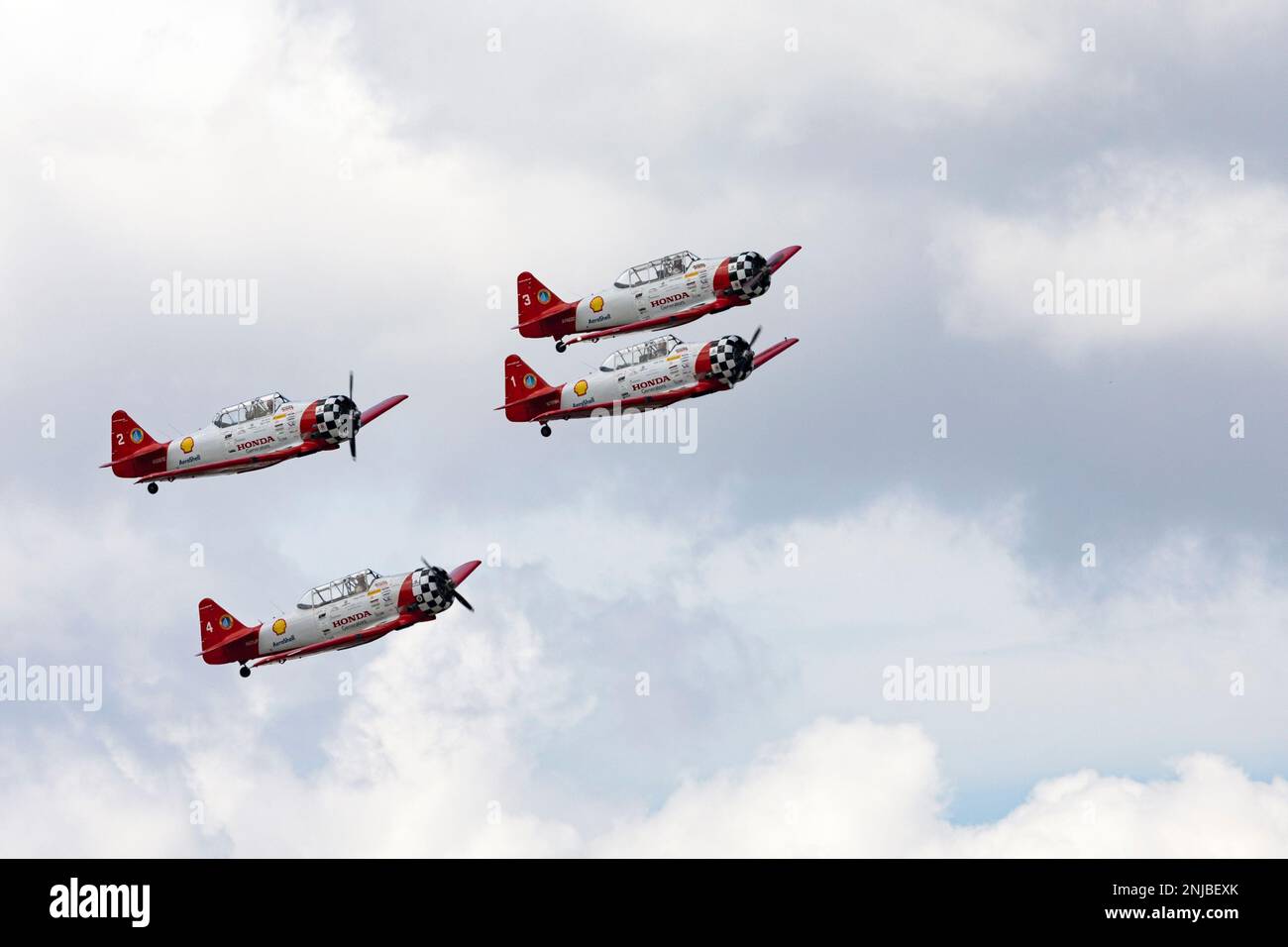 The Aeroshell Aerobatic Team fly by in their North American AT-6 Texan ...