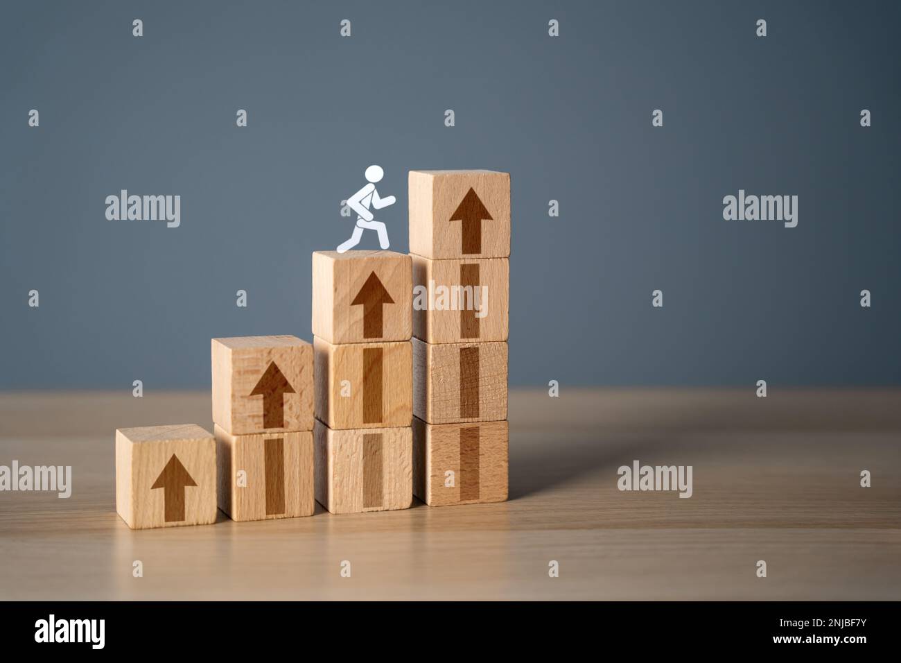 Man climbs the stairs to success. Movement towards the goal. Step by ...