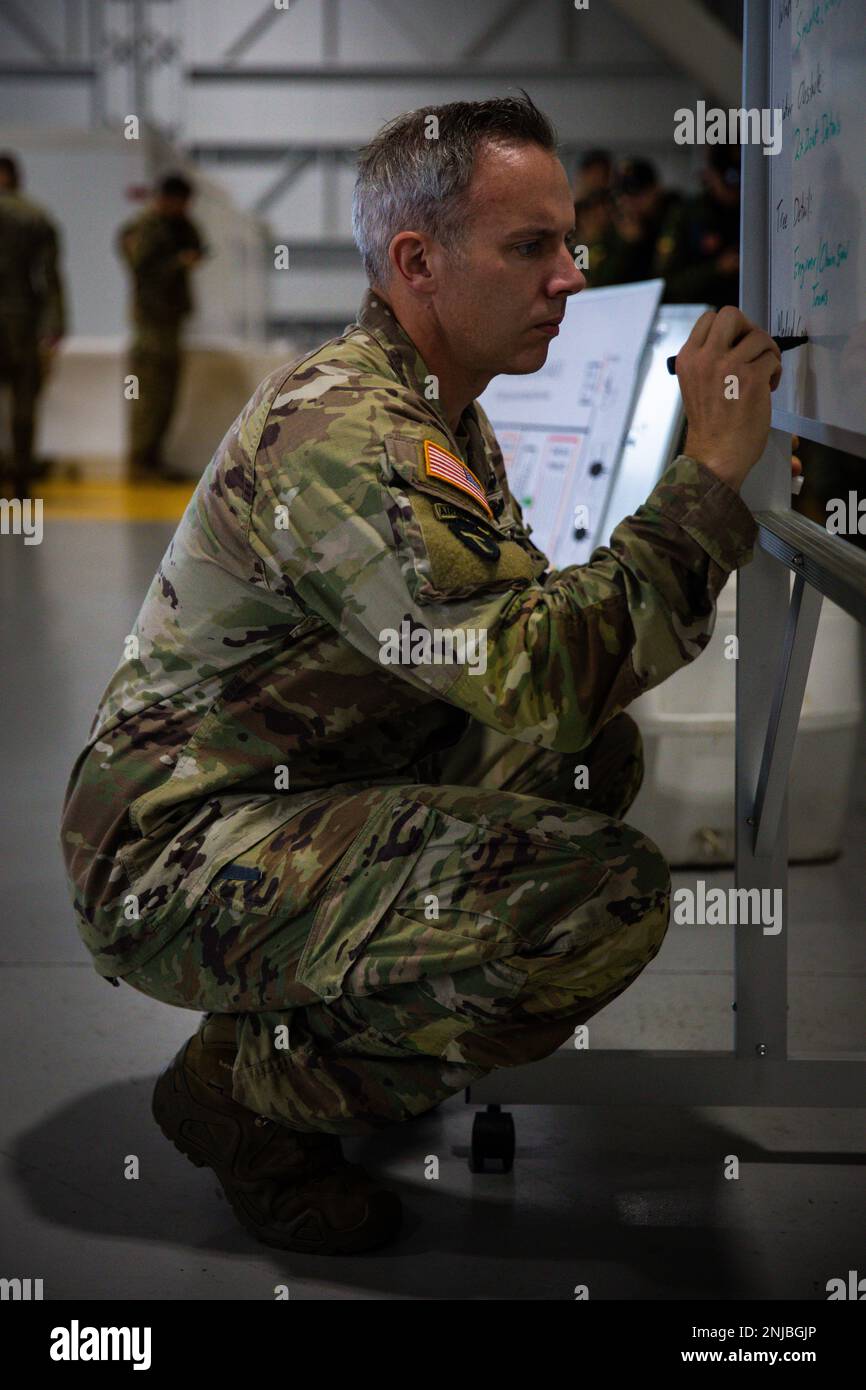 U.S. Army Major Jett Nelson, with the 56th Troop Command, prepares to ...