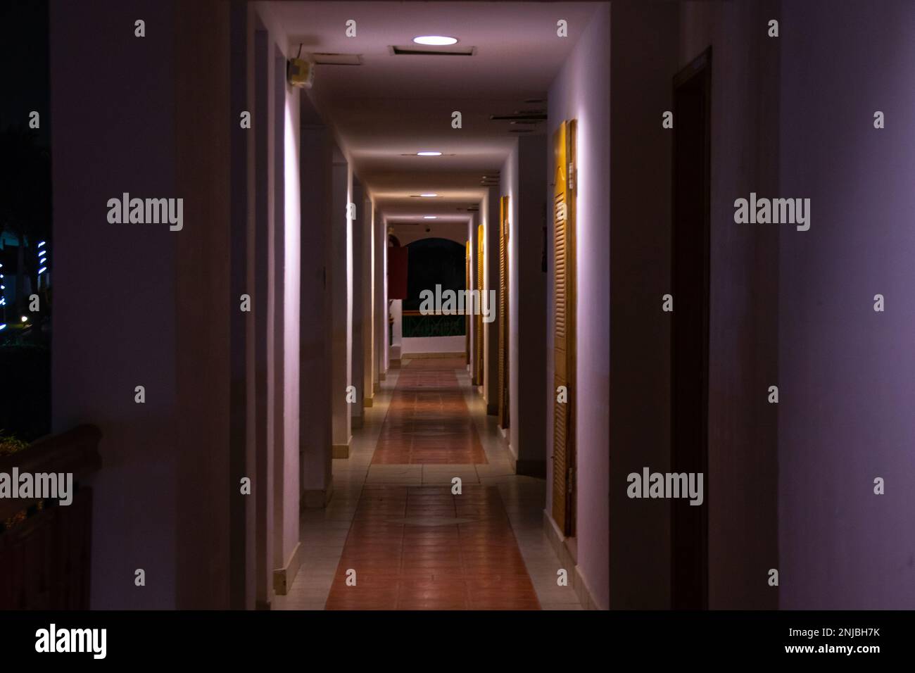 long straight corridor of a hotel hotel Stock Photo - Alamy
