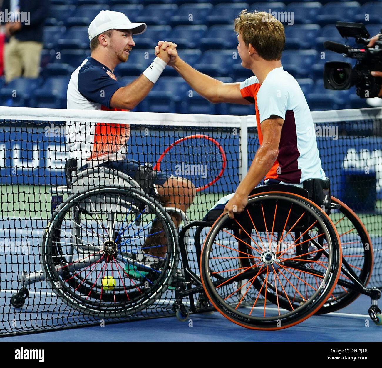 Sam Schroder and Niels Vink shake hands following a wheelchair quad ...