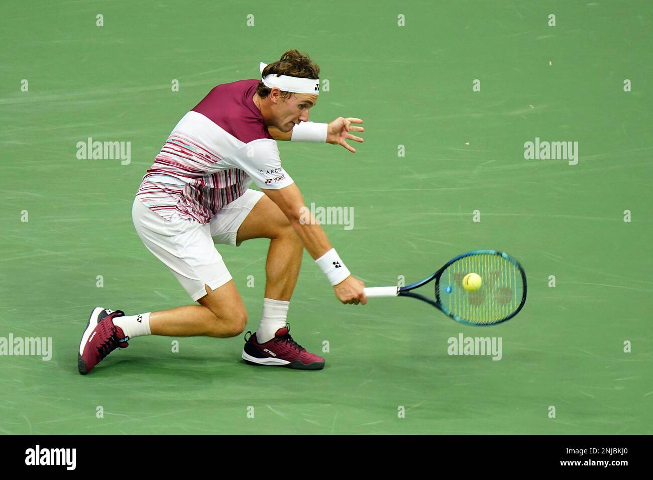 Casper Ruud returns during a men's singles championship match at the ...