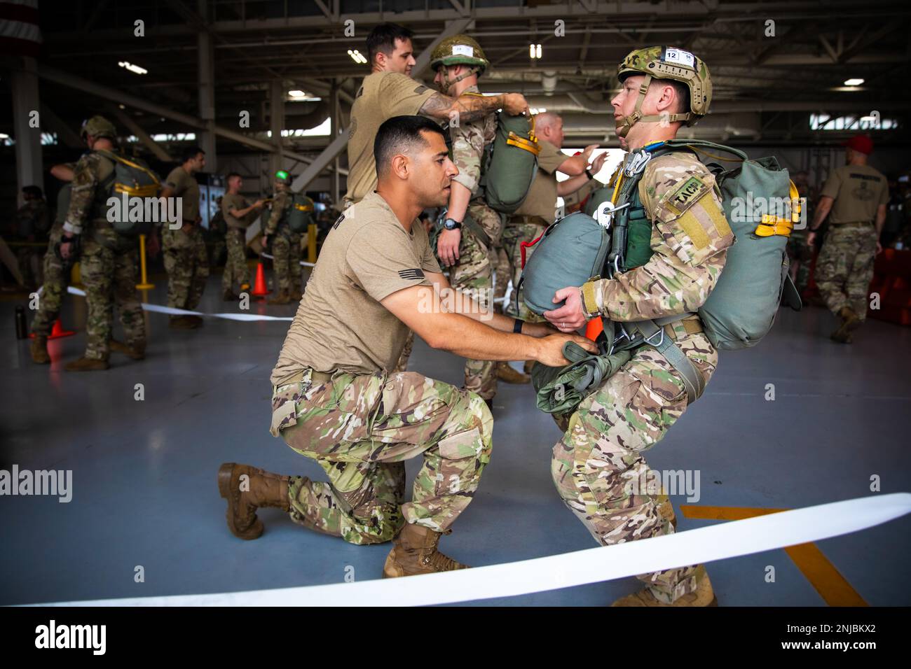 U.S. Army Jumpmaster, performs Jumpmaster Personal Inspection (JMPI) on ...