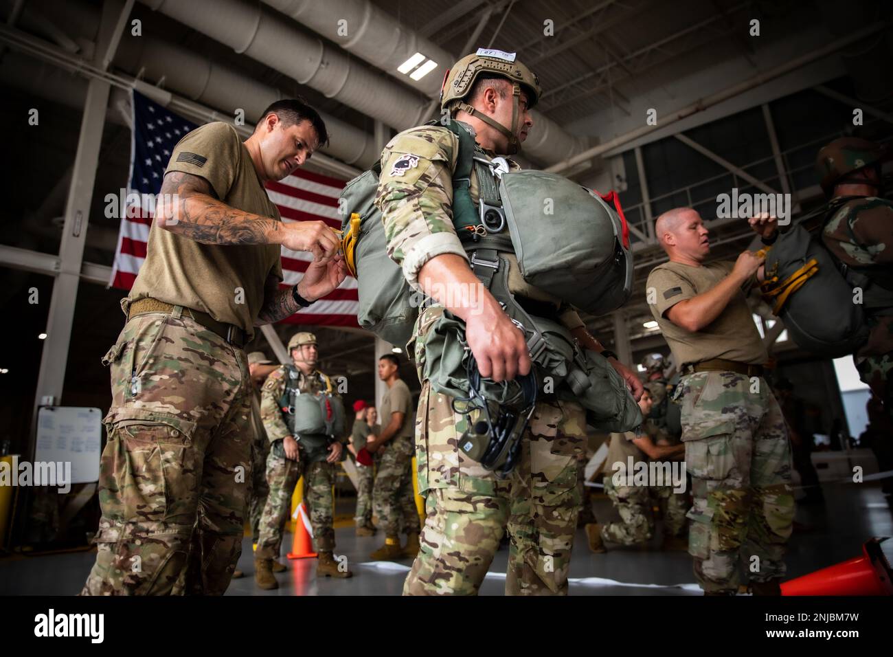 U.S. Army Jumpmaster, performs Jumpmaster Personal Inspection (JMPI) on ...