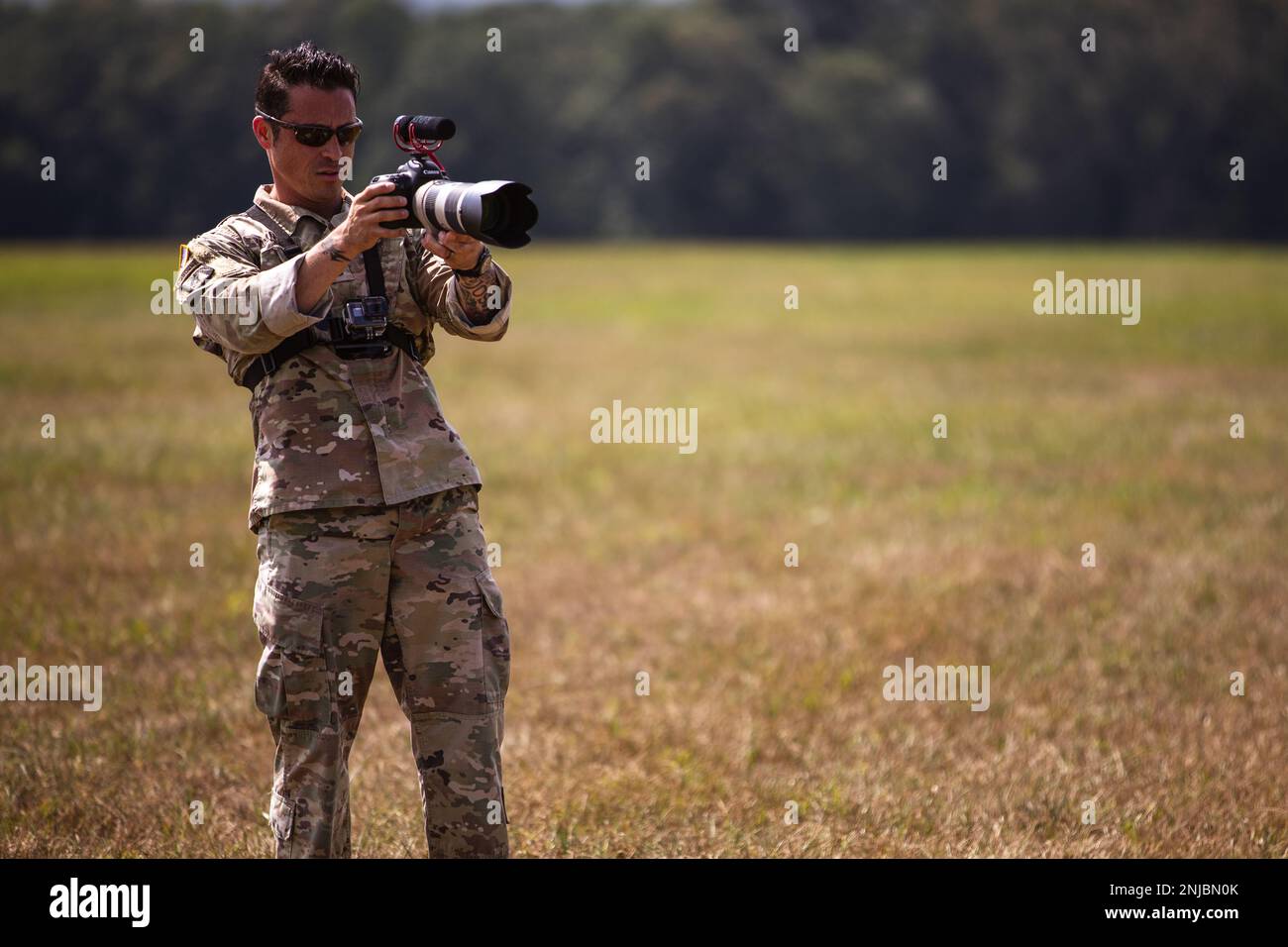 A U.S. Army Reserve Soldier from the 982nd Combat Camera Company (Airborne) documents soldiers ...