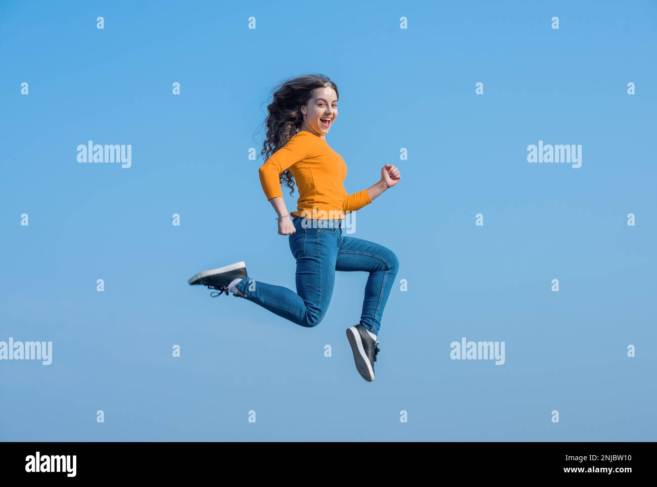 happy teen girl jump high on sky background. motivation Stock Photo - Alamy