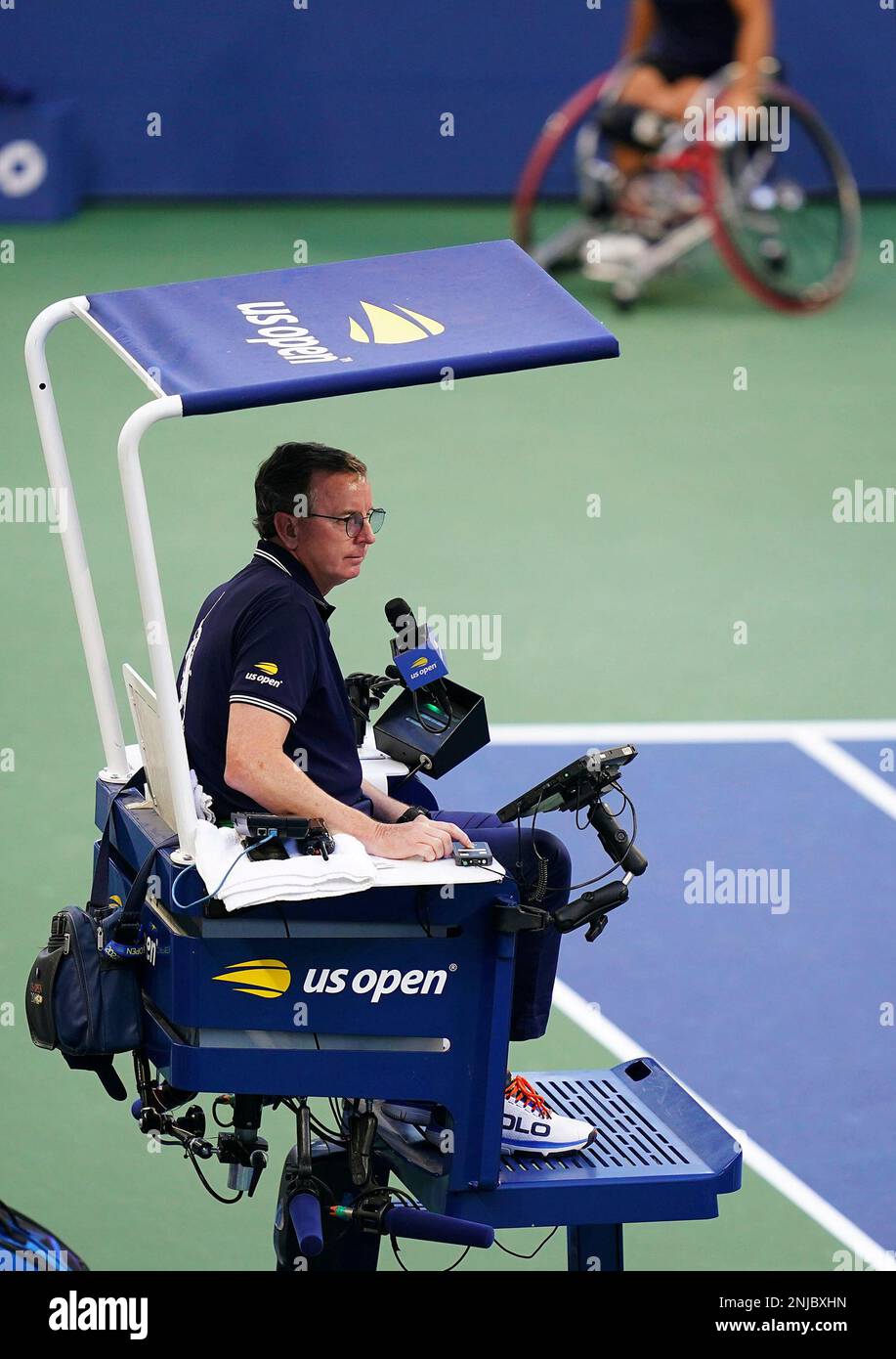 A chair umpire during a wheelchair women's doubles championship match ...
