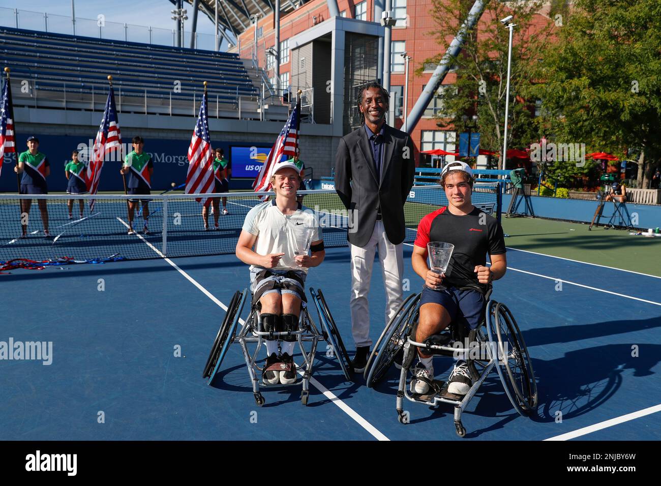 Ben Bartram, Dahnon Ward, and USTA staff pose with trophies during ...