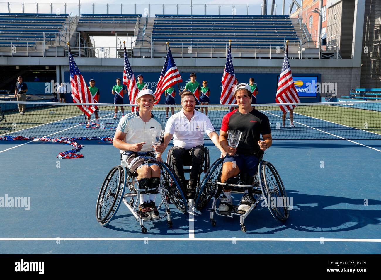 Ben Bartram, Dahnon Ward, and USTA staff pose with trophies during ...
