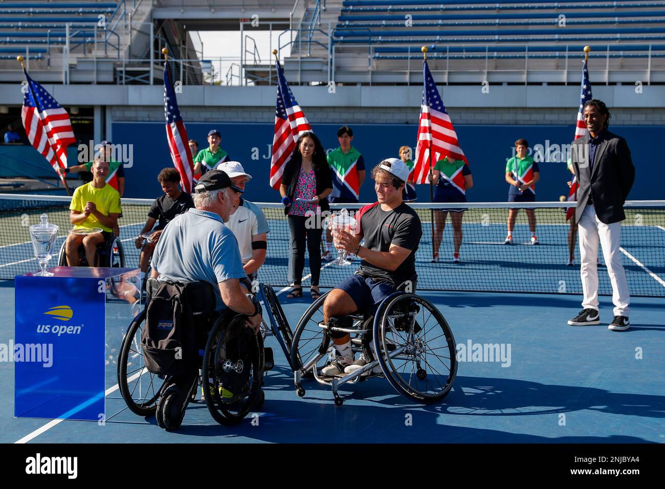 Ben Bartram and Dahnon Ward receive trophies during a junior wheelchair ...