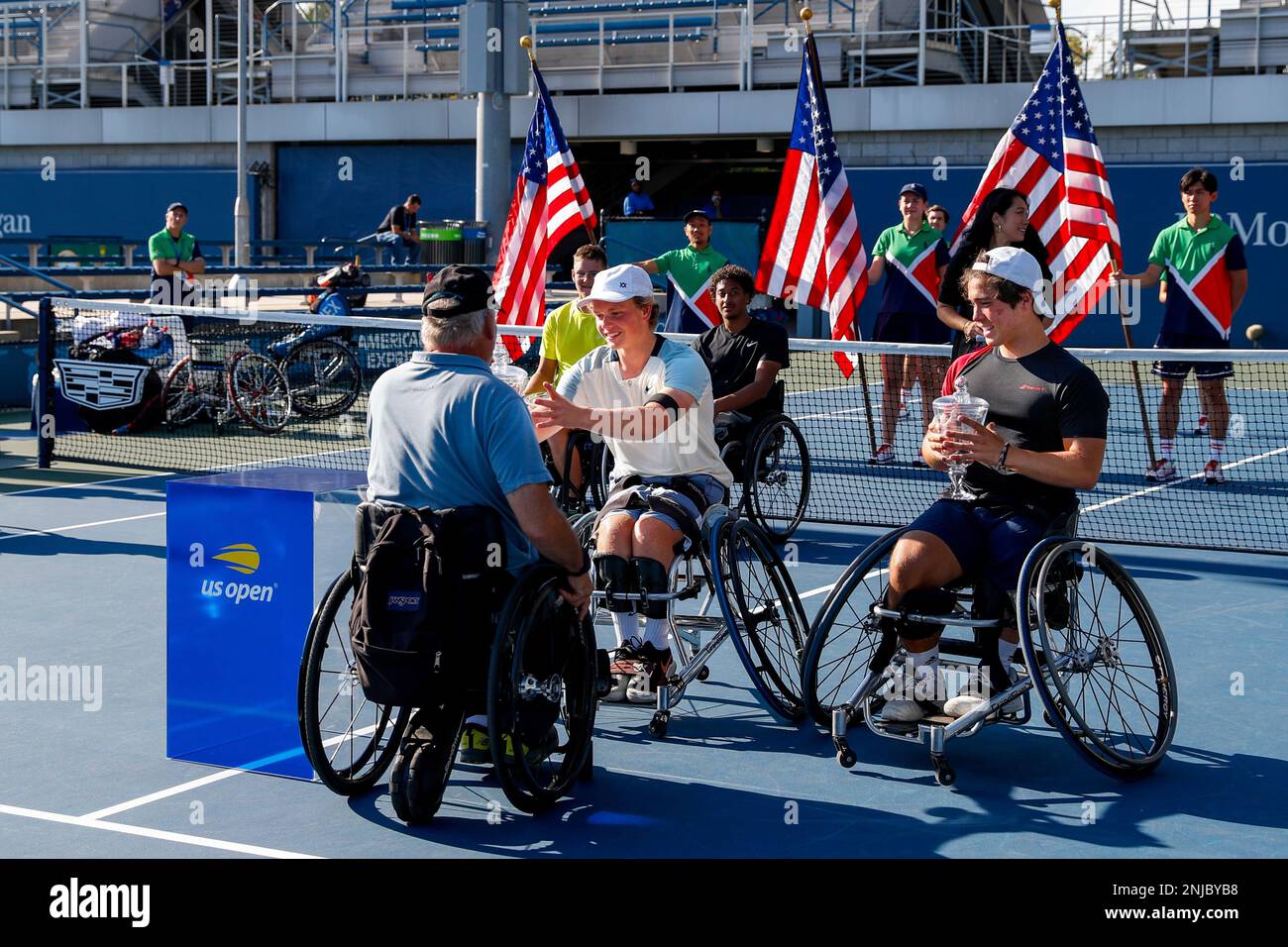 Ben Bartram and Dahnon Ward receive trophies during a junior wheelchair ...