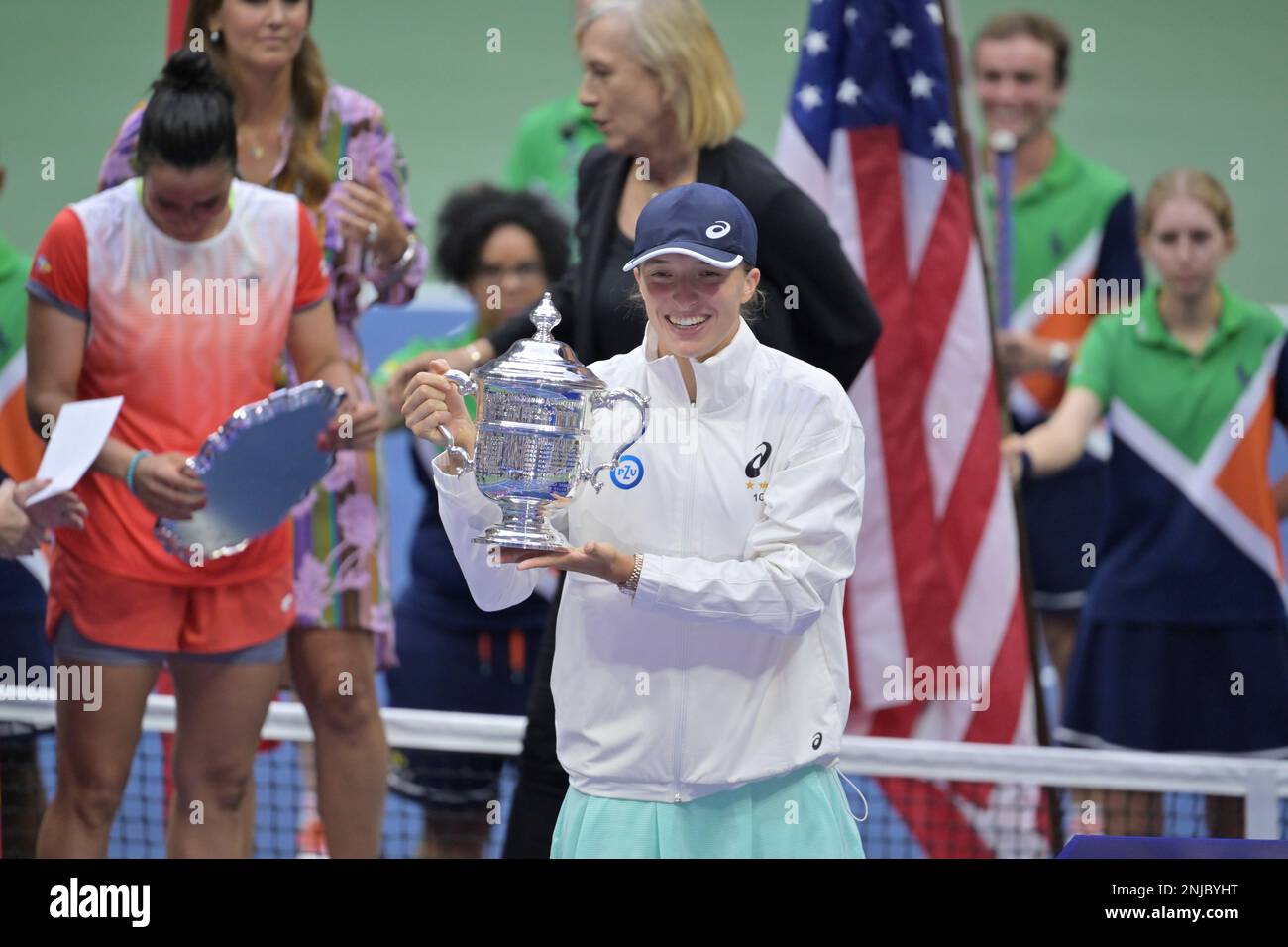 Iga Swiatek poses with the trophy during a women's singles championship ...