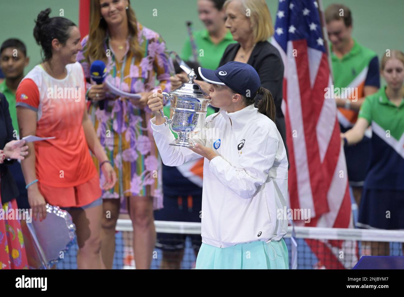 Iga Swiatek poses with the trophy during a women's singles championship ...