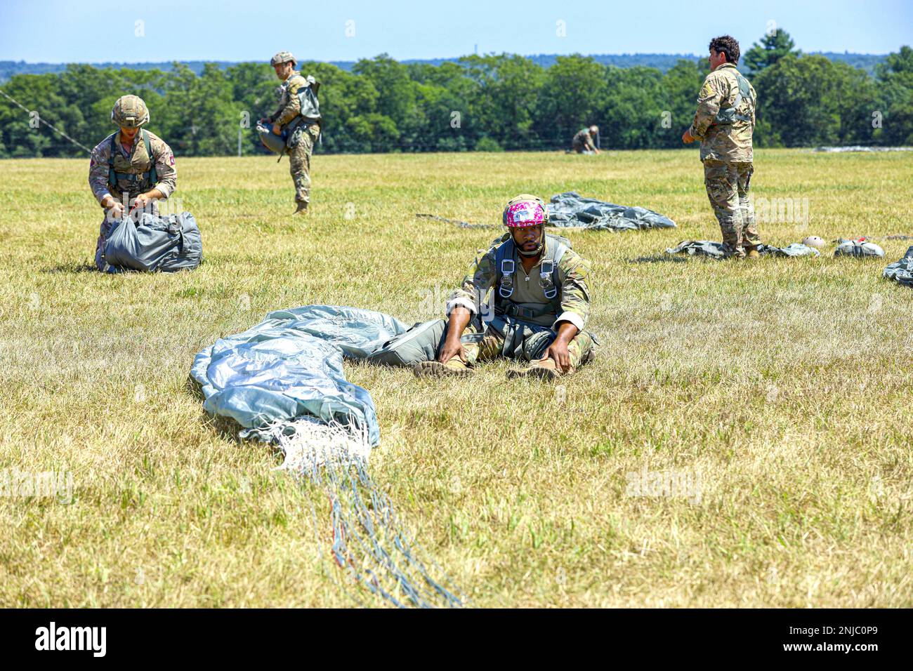 A US Airforce paratrooper takes a moment to relax after his shoot ...