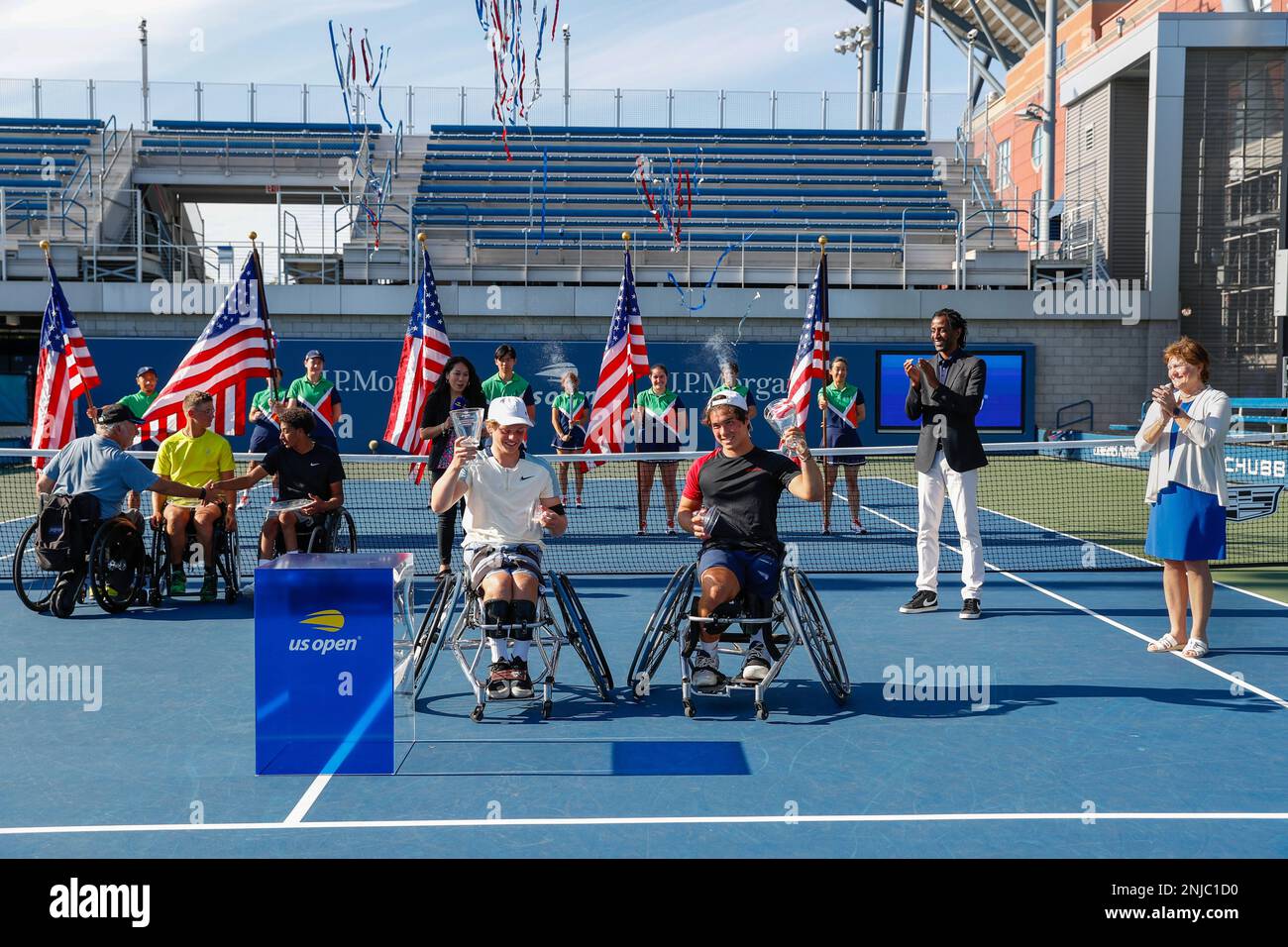 Ben Bartram and Dahnon Ward pose with trophies during a wheelchair ...