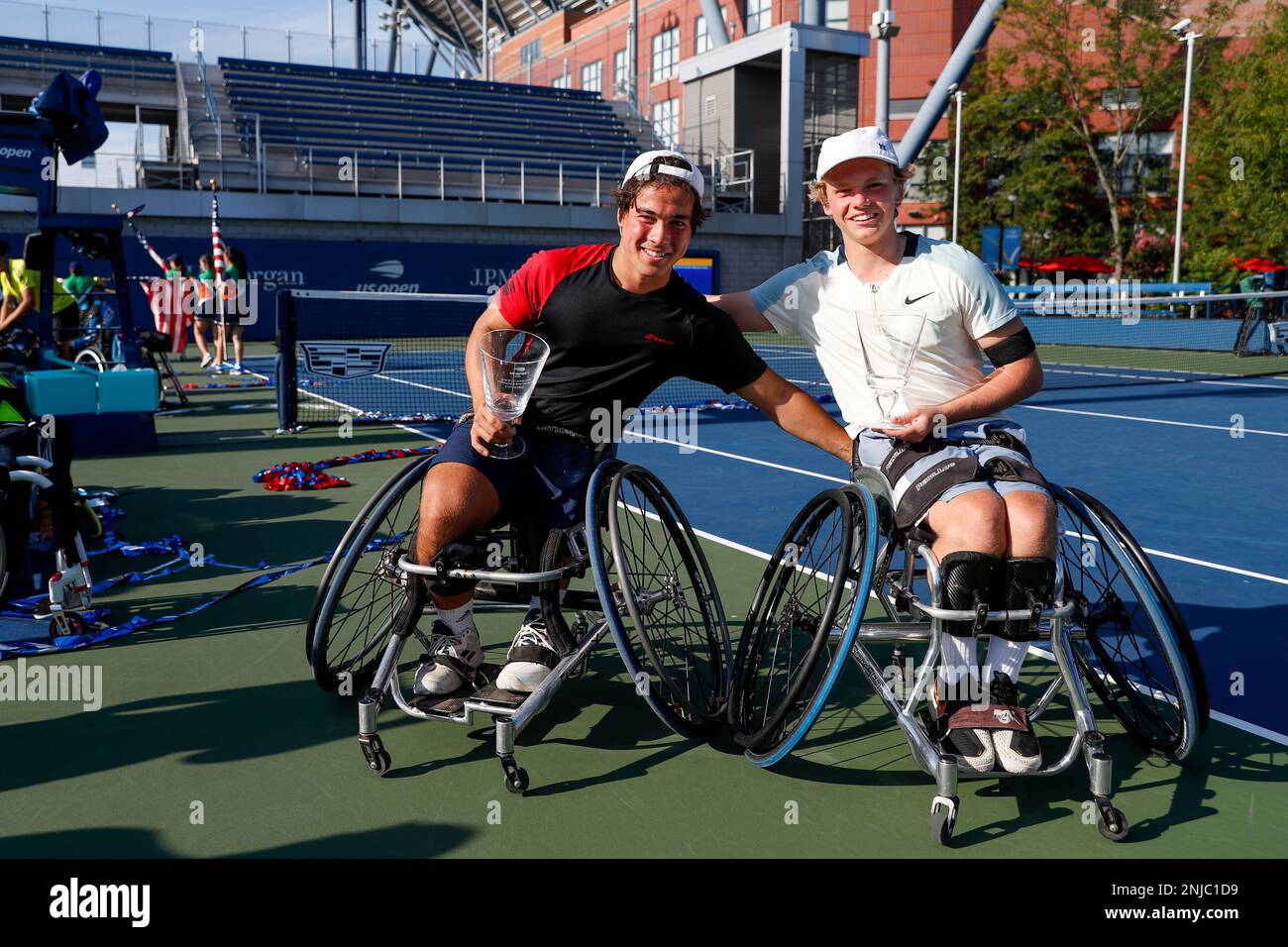 Dahnon Ward and Ben Bartram pose with trophies during a wheelchair ...