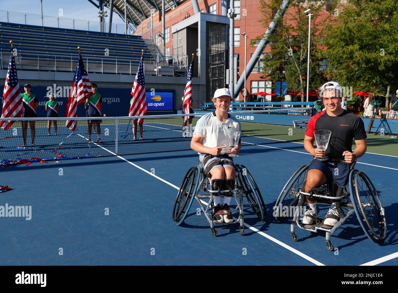 Ben Bartram and Dahnon Ward pose with trophies during a wheelchair ...