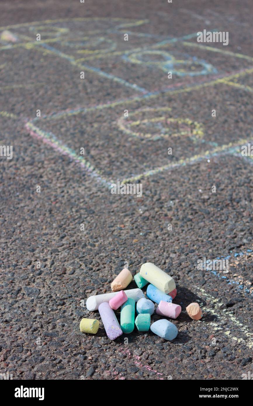 Hopscotch playground game drawn with children's colored chalk on ...