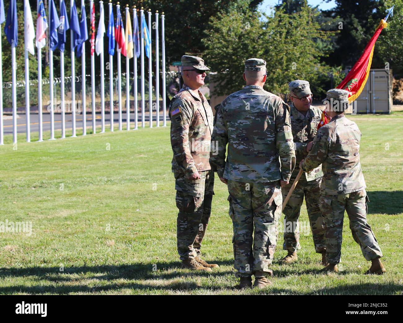 LTC Josh Daily, incoming commander passes the Battalion colors to ...