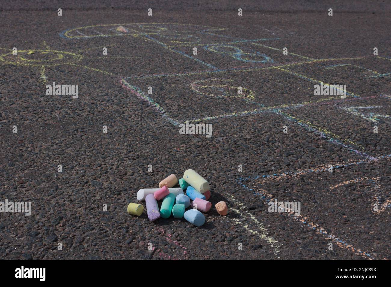 Hopscotch playground game drawn with children's colored chalk on ...