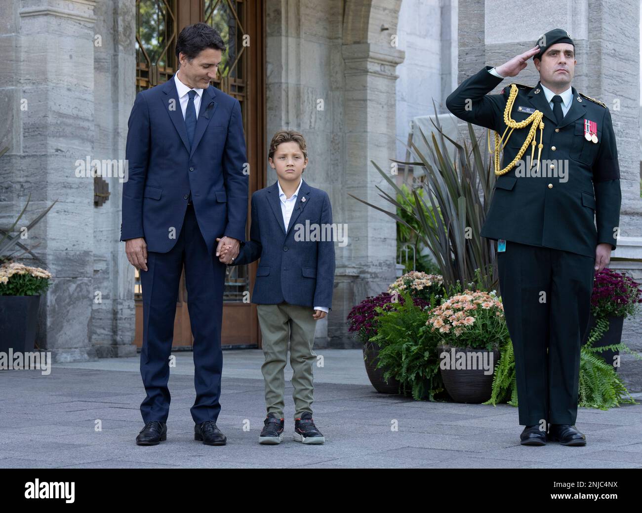 Canadian Prime Minister Justin Trudeau looks at his son Hadrien as God ...