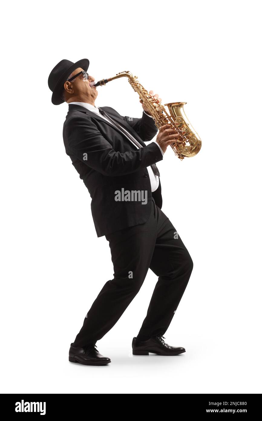 Full length profile shot of a mature elegant musician playing a sax ...
