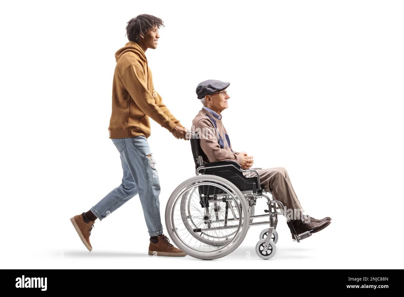 Full length profile shot of an african american young man pushing a ...
