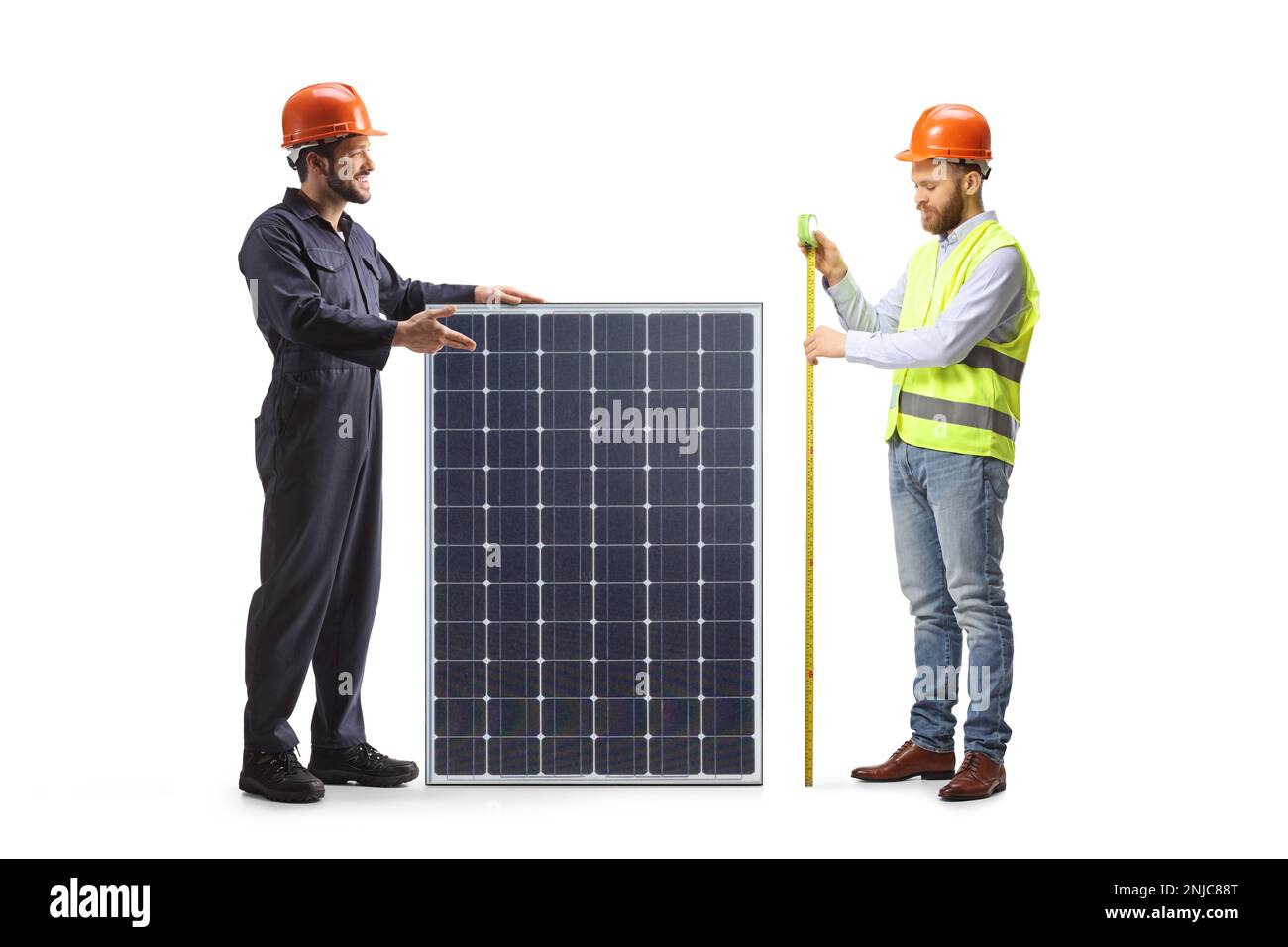 An engineer and a worker standing with a solar panel isolated on white ...