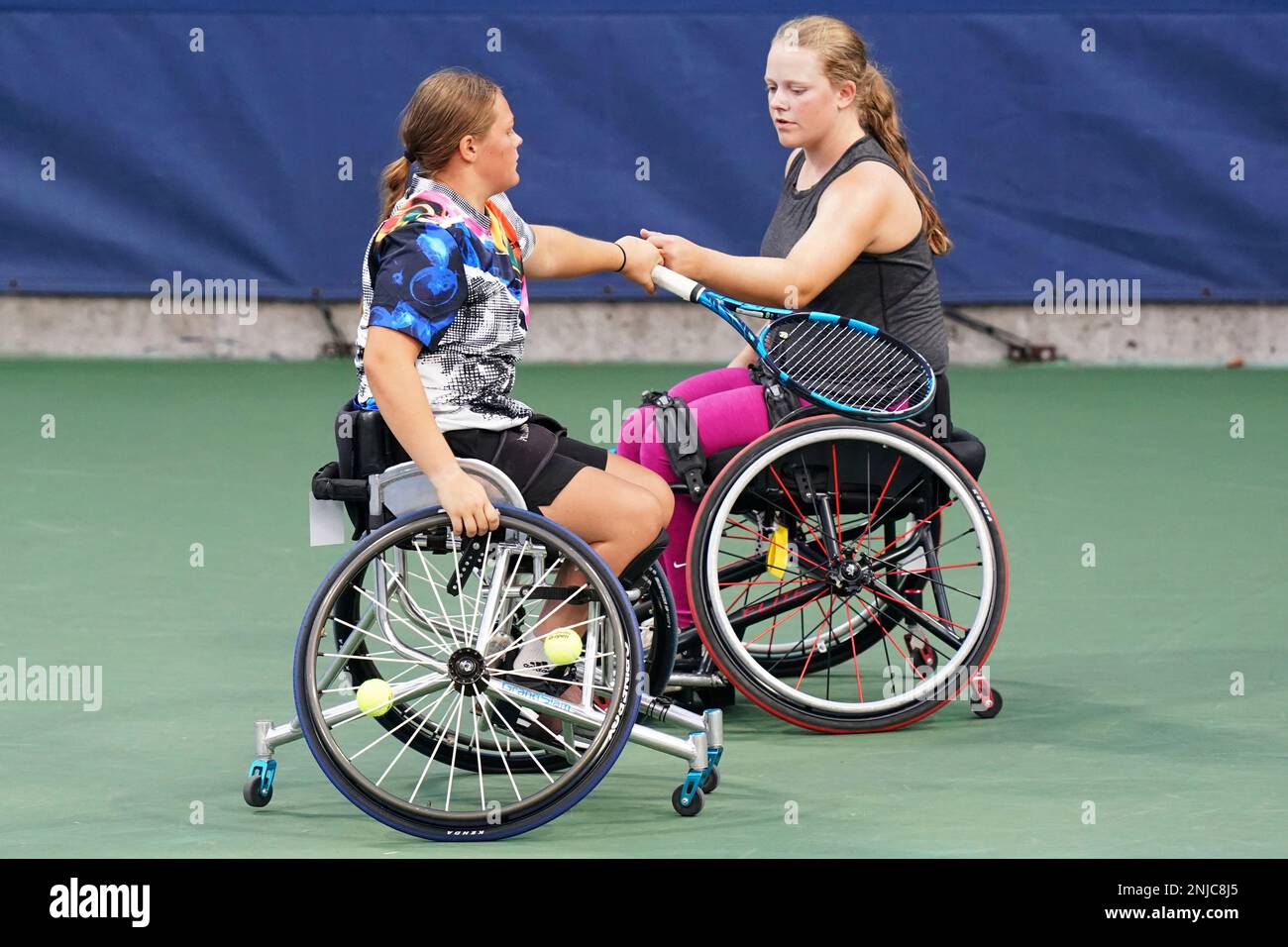 Ruby Bishop and Lily Lautenschlager react during a junior wheelchair ...