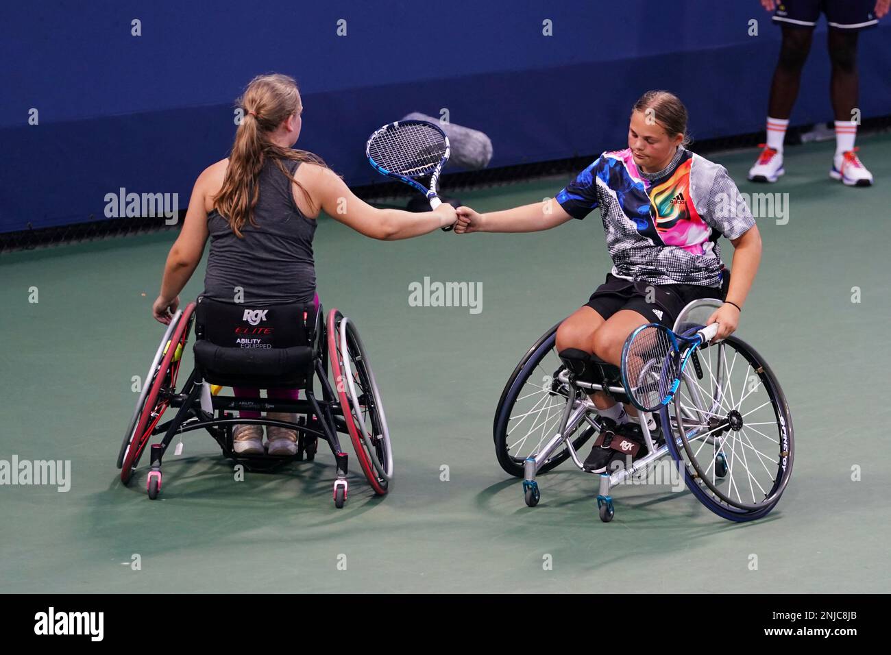Ruby Bishop and Lily Lautenschlager react during a junior wheelchair ...