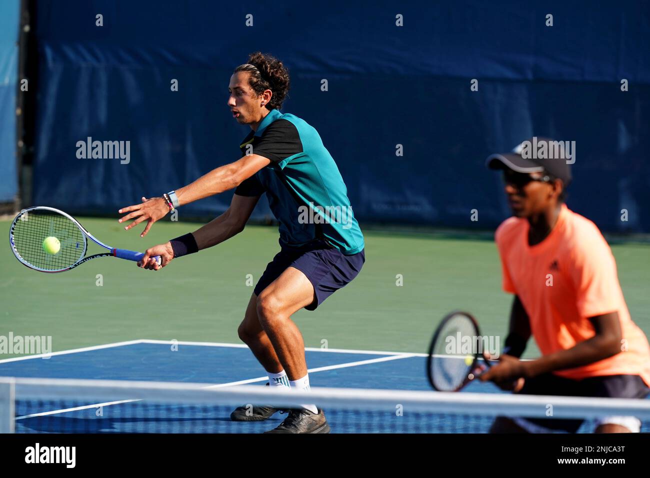 Ozan Baris and Nishesh Basavareddy during a junior boys' doubles ...