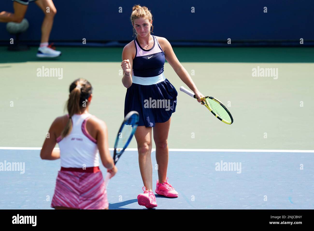 Natalie Block and Piper Charney react during a junior girls' doubles ...