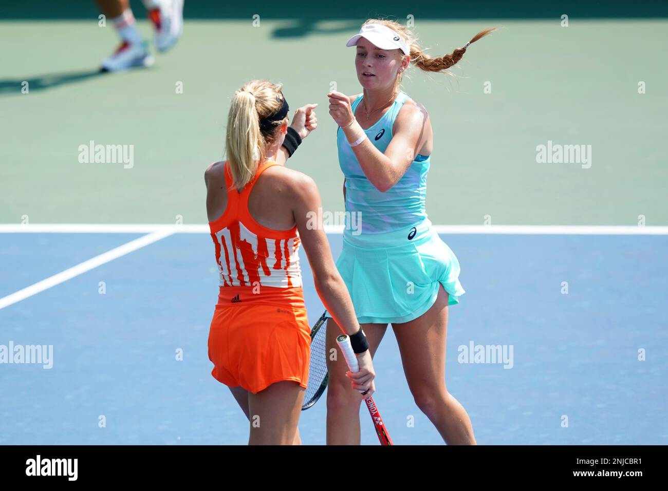Liv Hovde and Taylah Preston react during a junior girls' doubles ...