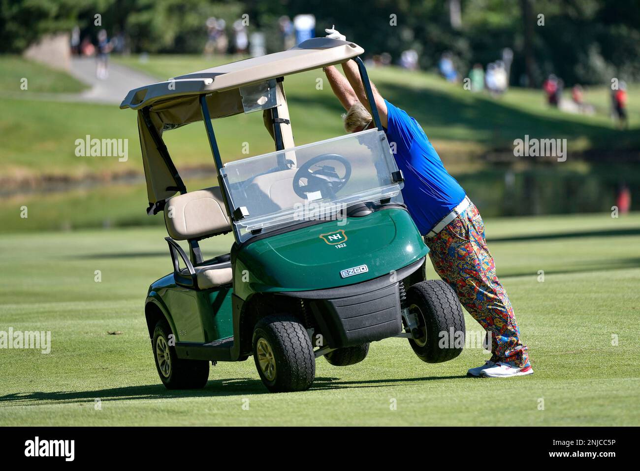 September 09, 2022: John Daly lifts the golf cart of it wheels while ...