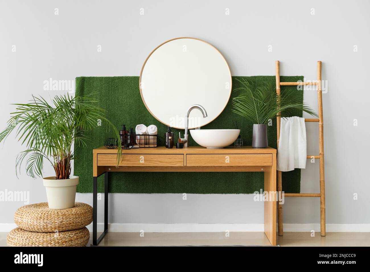 Interior of bathroom with sink, mirror and palm leaves Stock Photo - Alamy