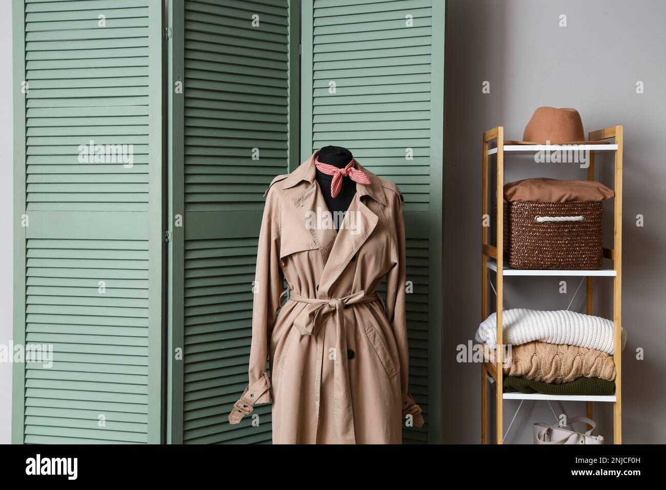 Interior of fashion designer's studio with mannequin, clothes and ...