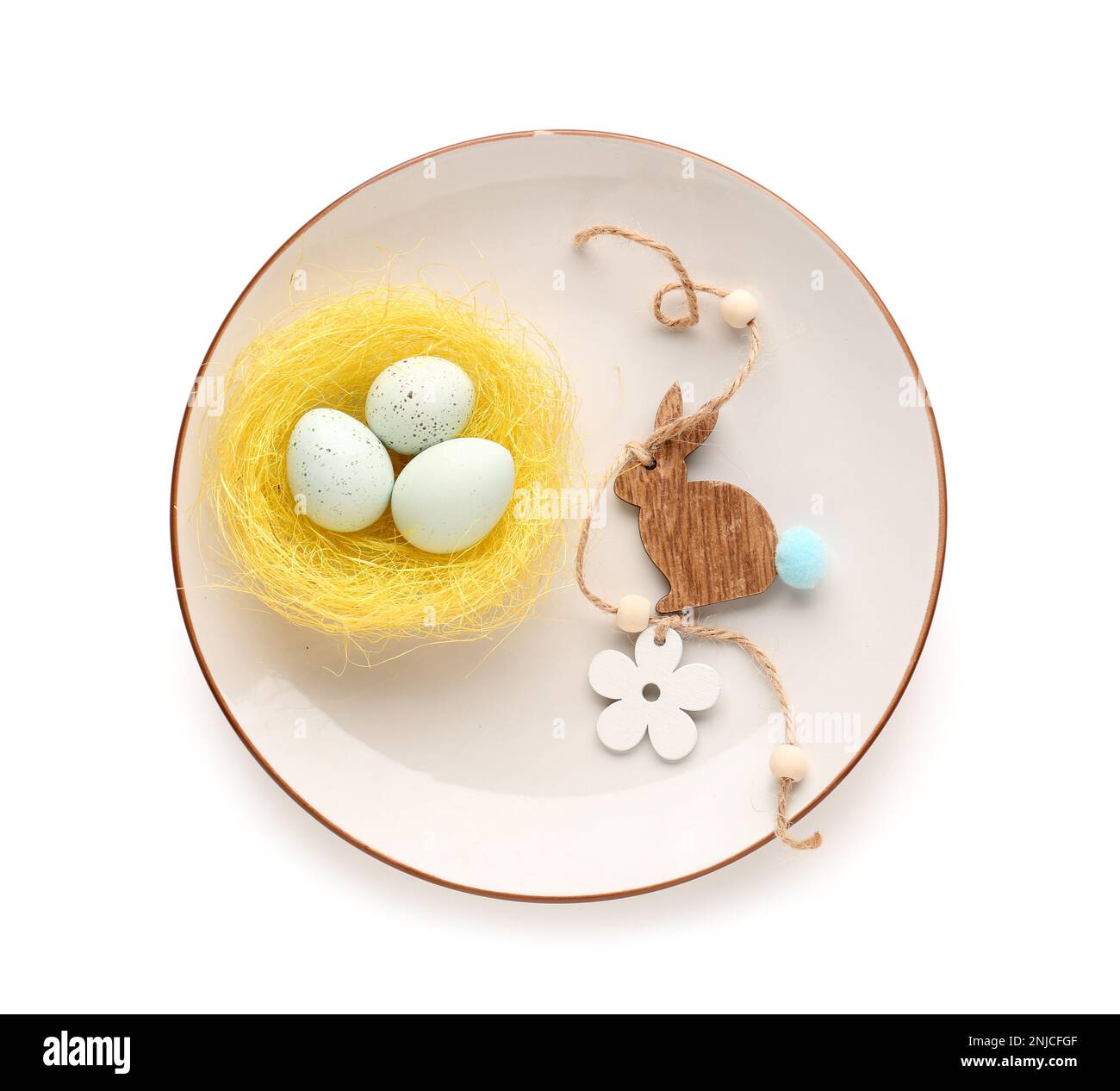 Table setting with bunny and Easter eggs in nest isolated on white ...