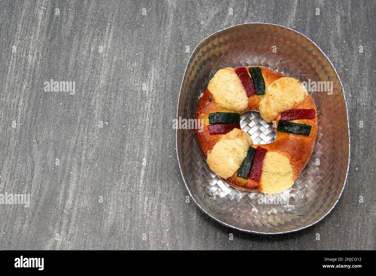 The roscon, rosca de Reyes or king cake, a torus-shaped sweet dough bun ...