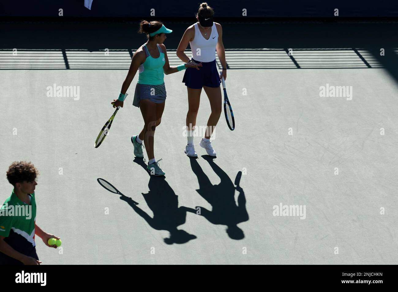 Malak El Allami and Ella McDonald react during a junior girls' doubles ...