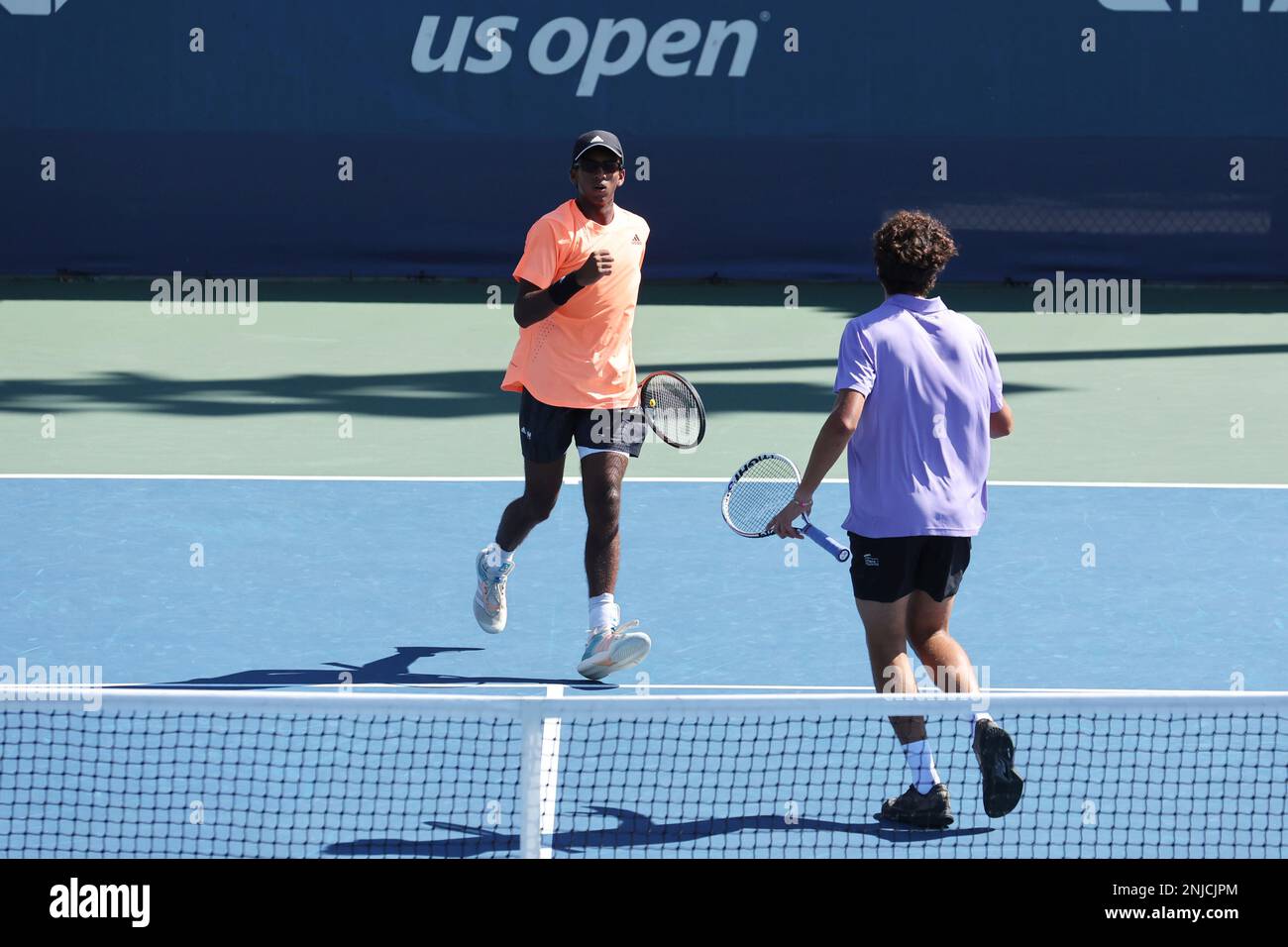 Ozan Baris and Nishesh Basavareddy react during a junior boys' doubles ...