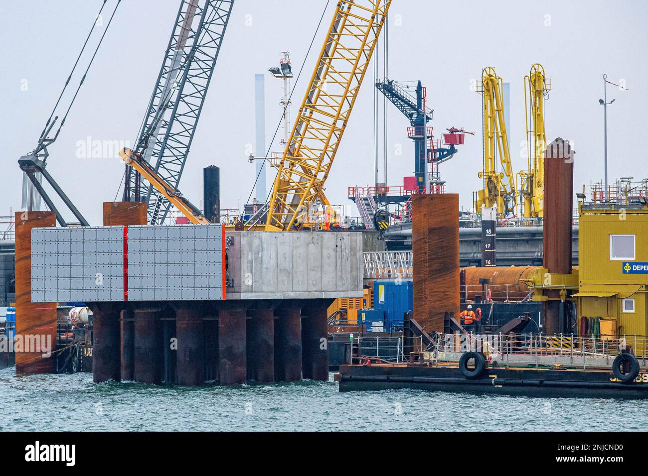 Construction work is taking place on the newly built jetty dolphins for ...