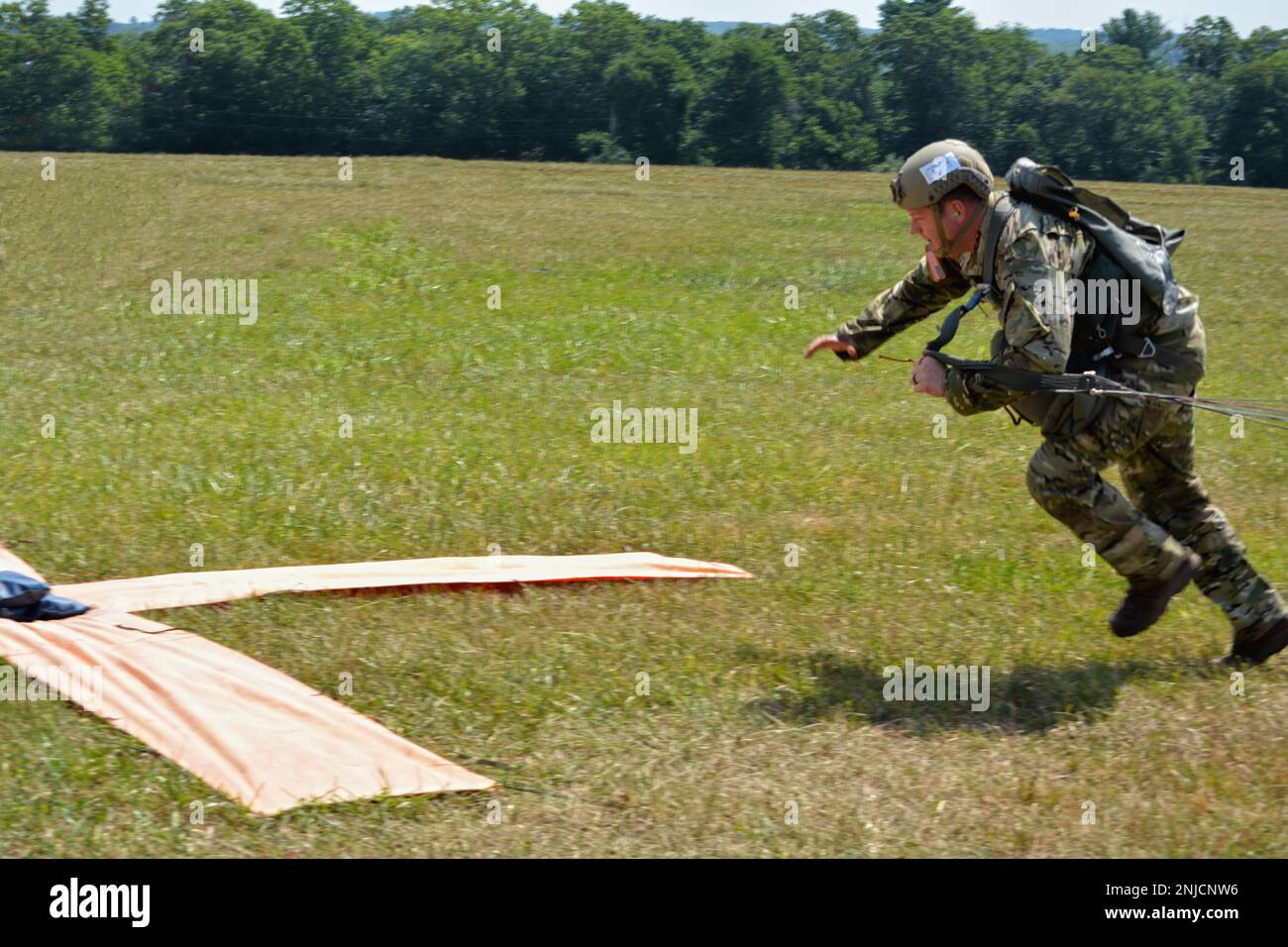 U.S. Army paratrooper runs towards target on Glen Rock Drop Zone during ...