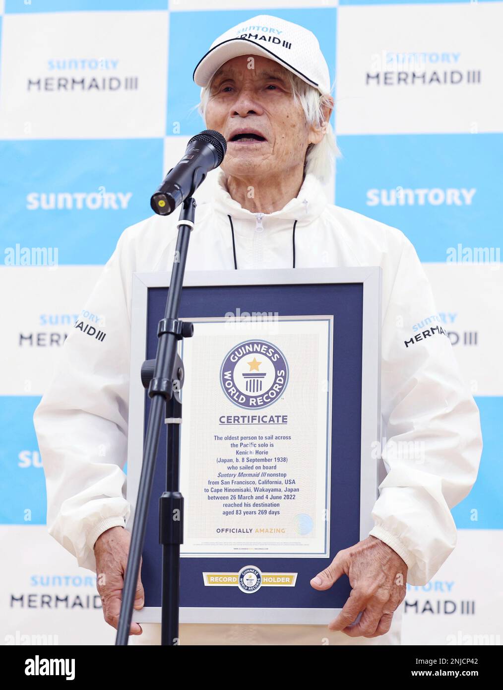 Japanese solo yachtsman Kenichi Horie holds a certificate of Guinness ...