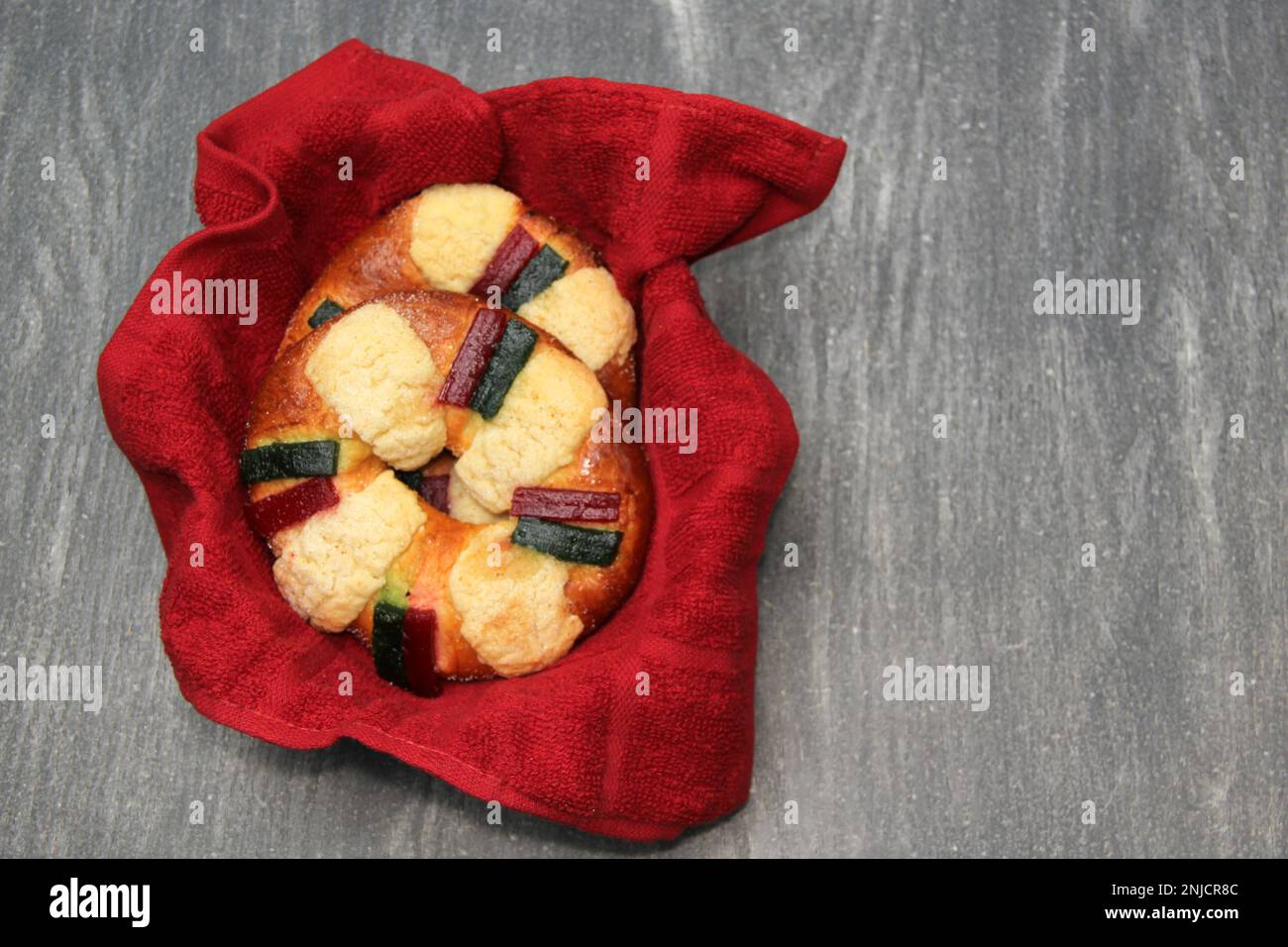 The roscon, rosca de Reyes or king cake is a sweet dough bun decorated ...